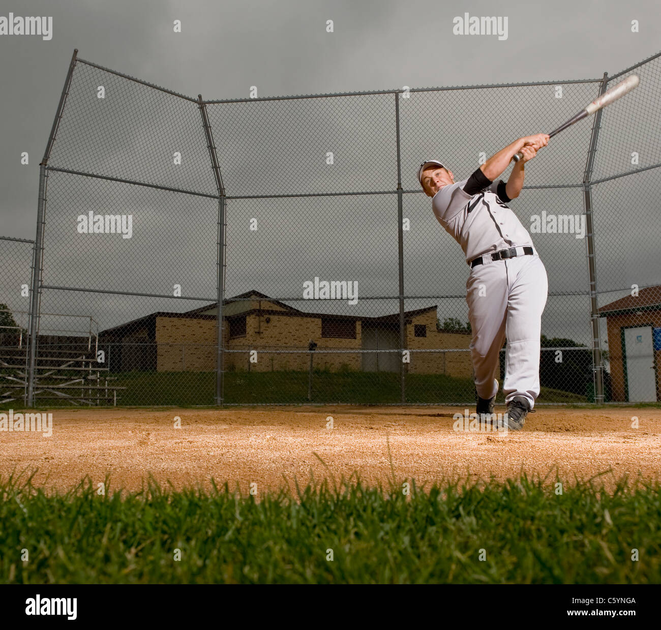 Young man practicing baseball batting hi-res stock photography and ...