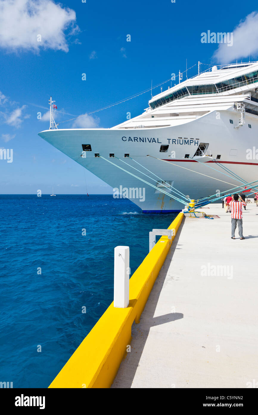 Cruise ship passengers on pier near Carnival Triumph cruise ship in ...