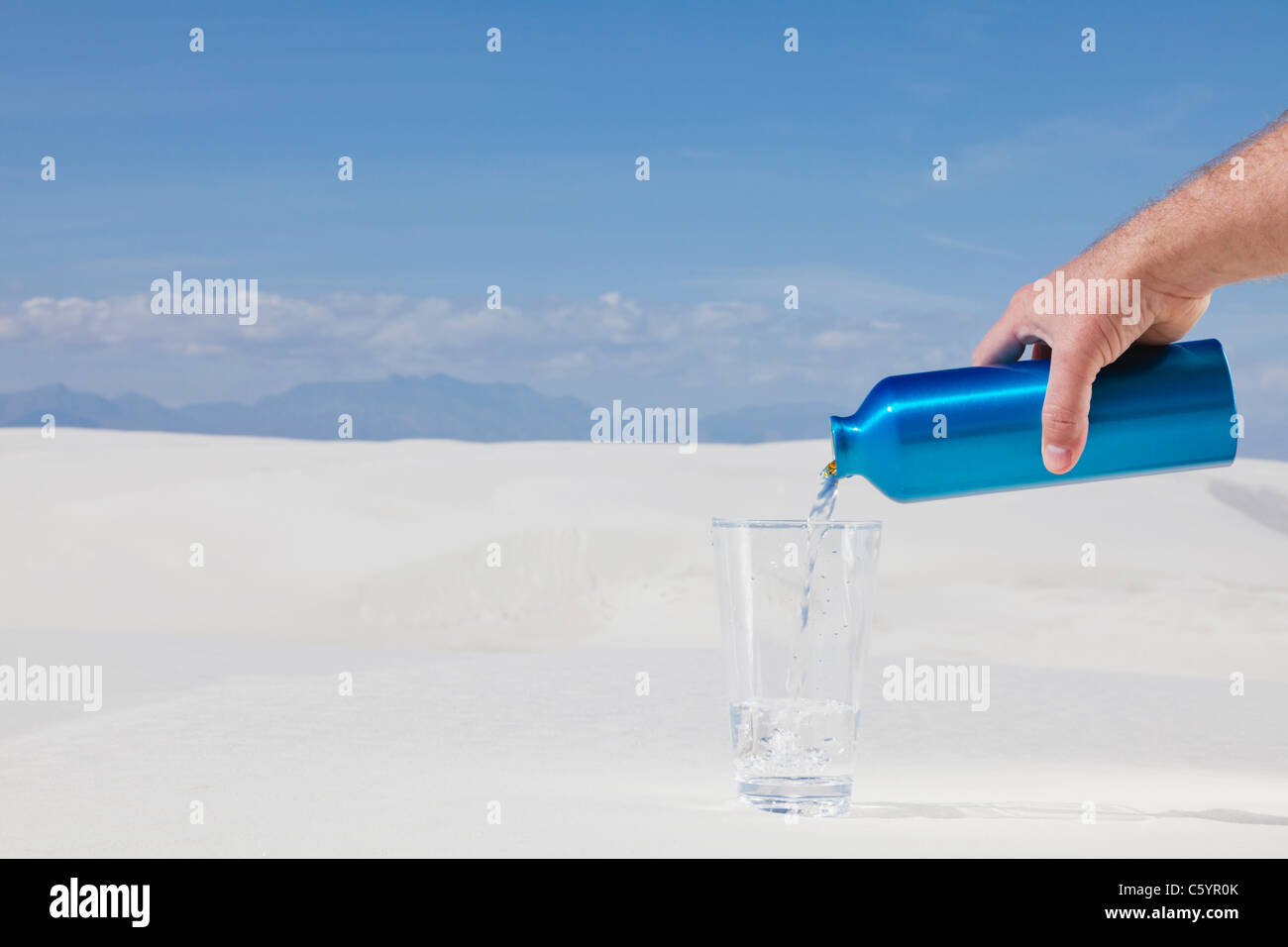 Horizontal pouring water on blue hi-res stock photography and images ...