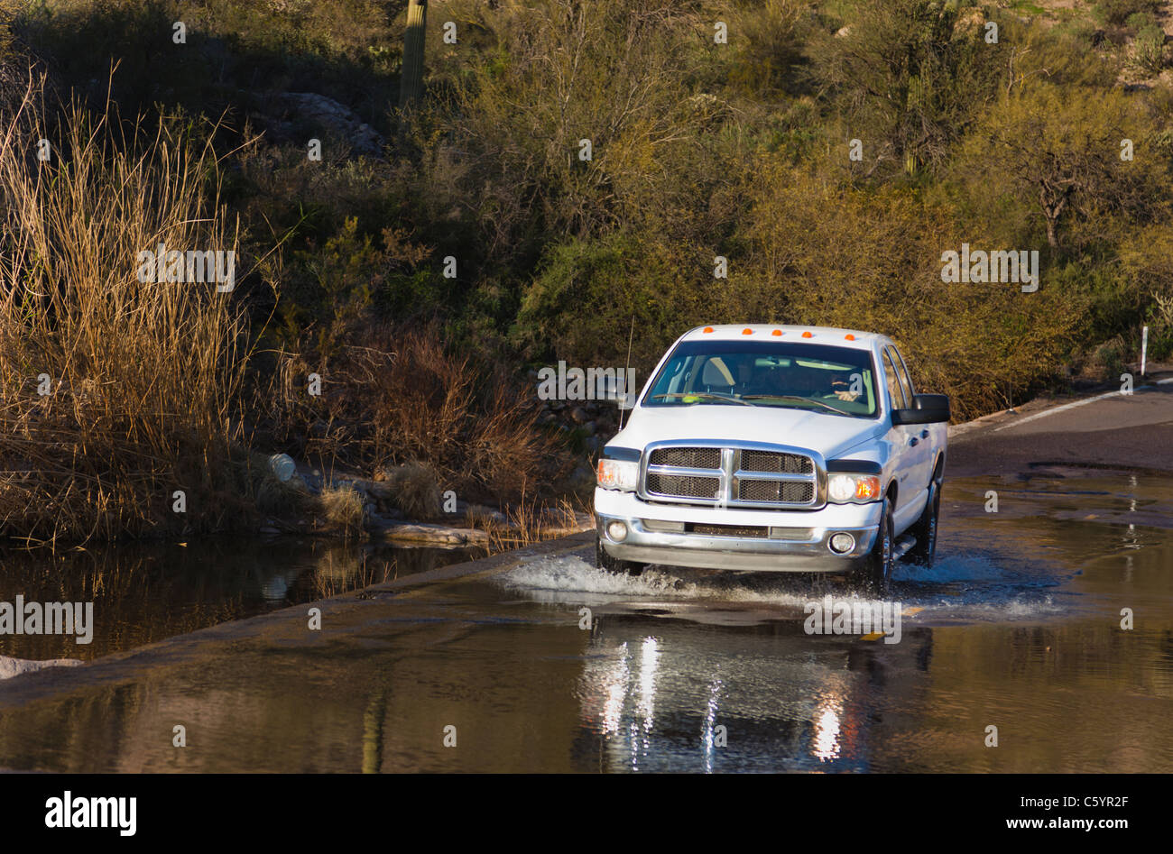 Car in puddle hi-res stock photography and images - Alamy
