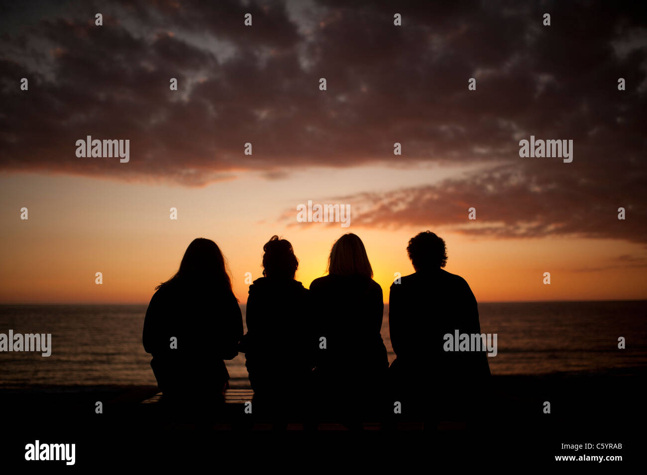 Women watching the sunset hi-res stock photography and images - Alamy