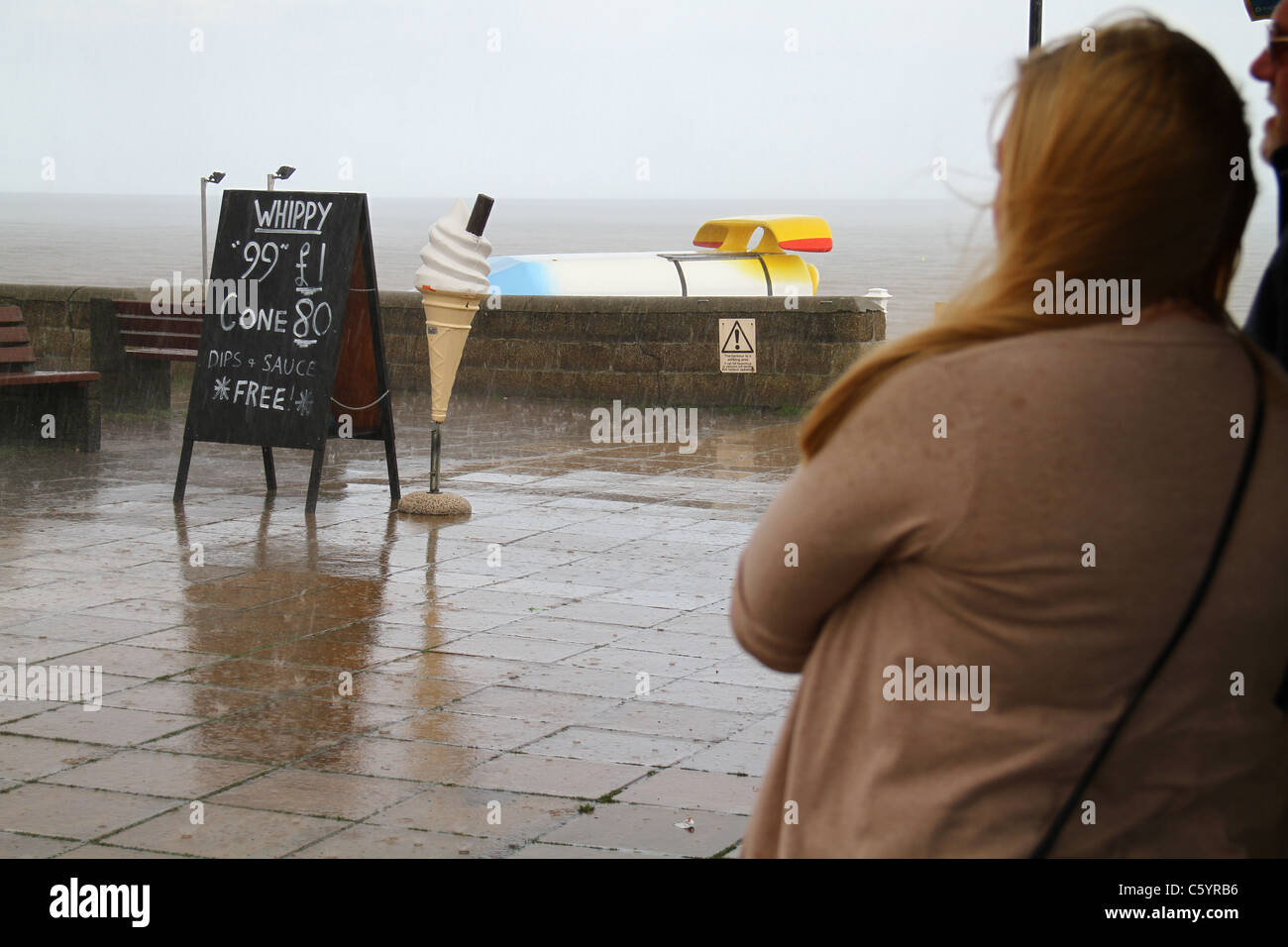 Very wet weather on sea front Stock Photo - Alamy