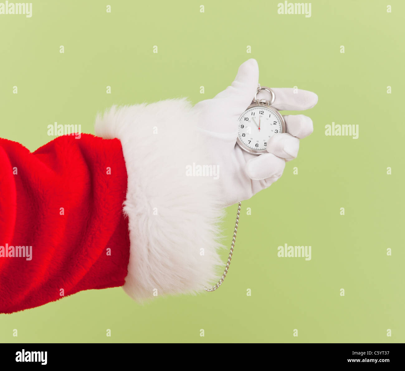 Santa clause holding pocket watch Stock Photo - Alamy