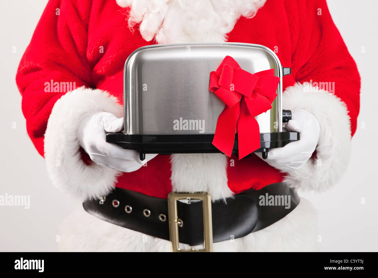 Santa clause holding toaster Christmas gift Stock Photo - Alamy