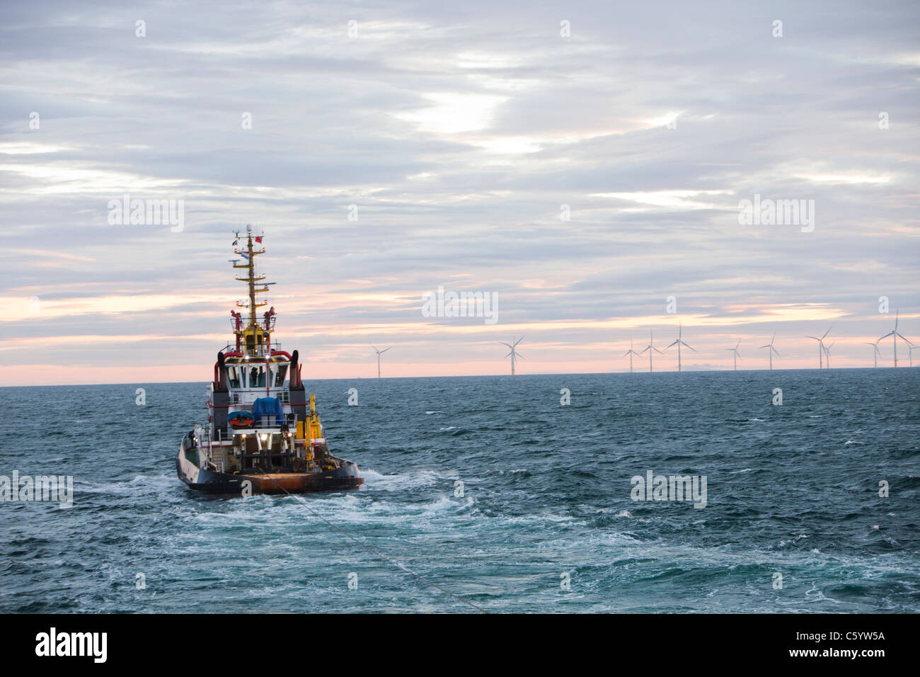 A tug boat tows the jack up barge the Goliath towards the Walney ...
