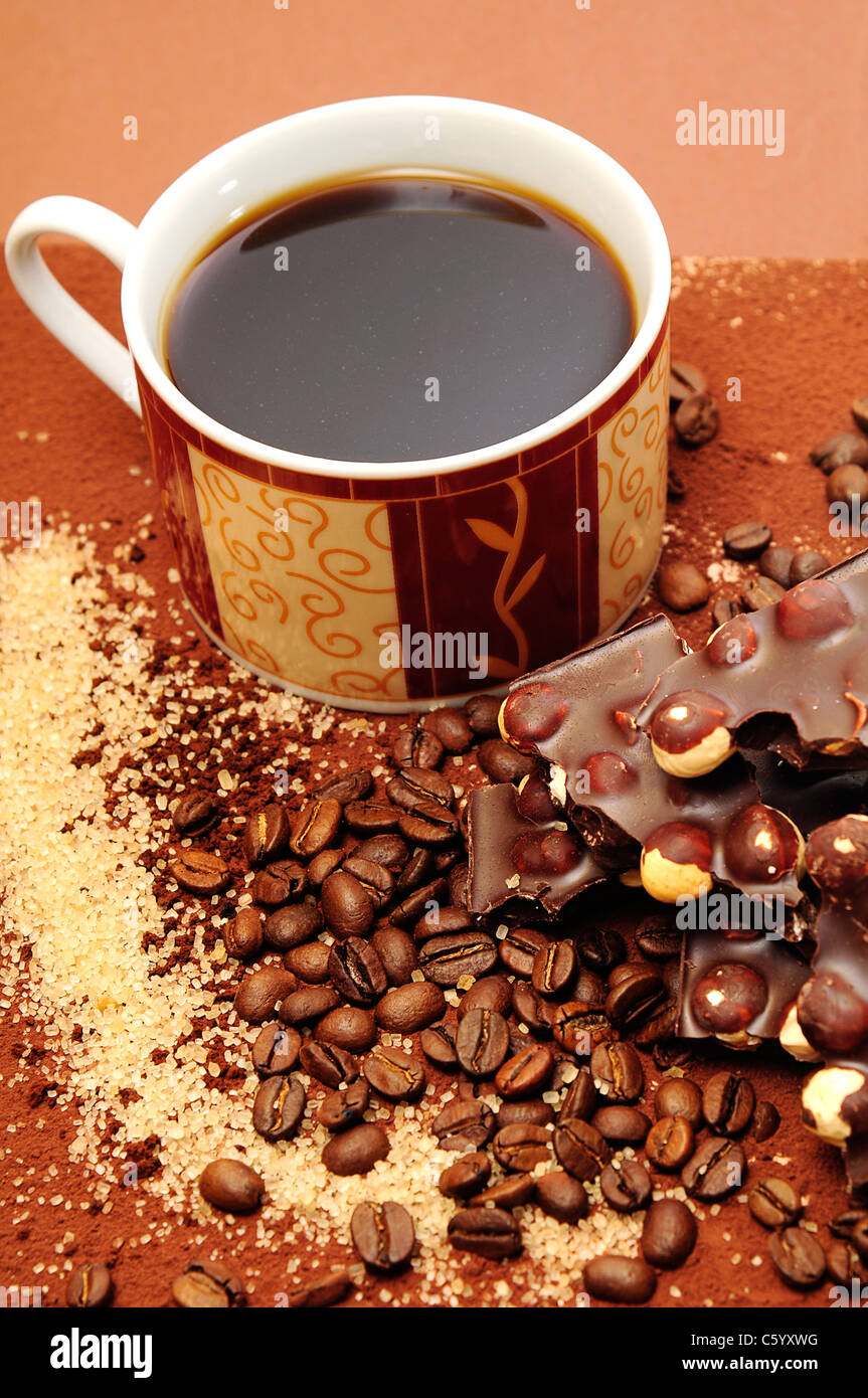 Chocolate with nuts on the brown background. Coffee drink Stock Photo ...
