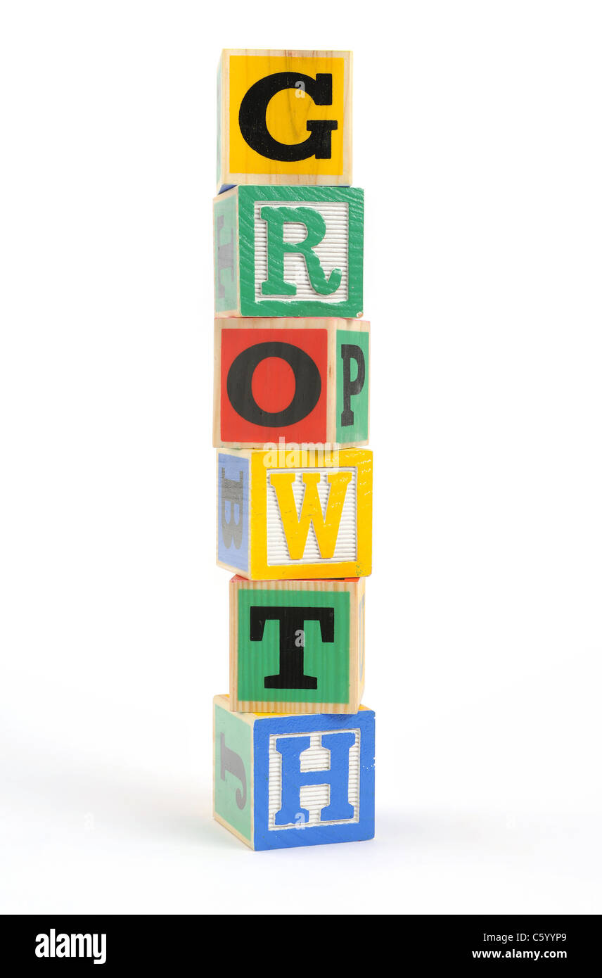 the word 'growth' spelled out with children's letter blocks Stock Photo ...