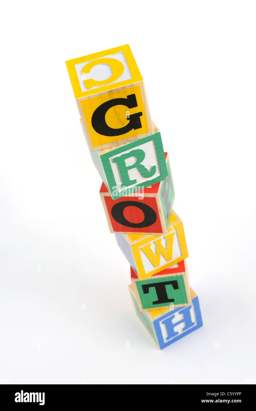 the word 'growth' spelled out with children's letter blocks Stock Photo ...
