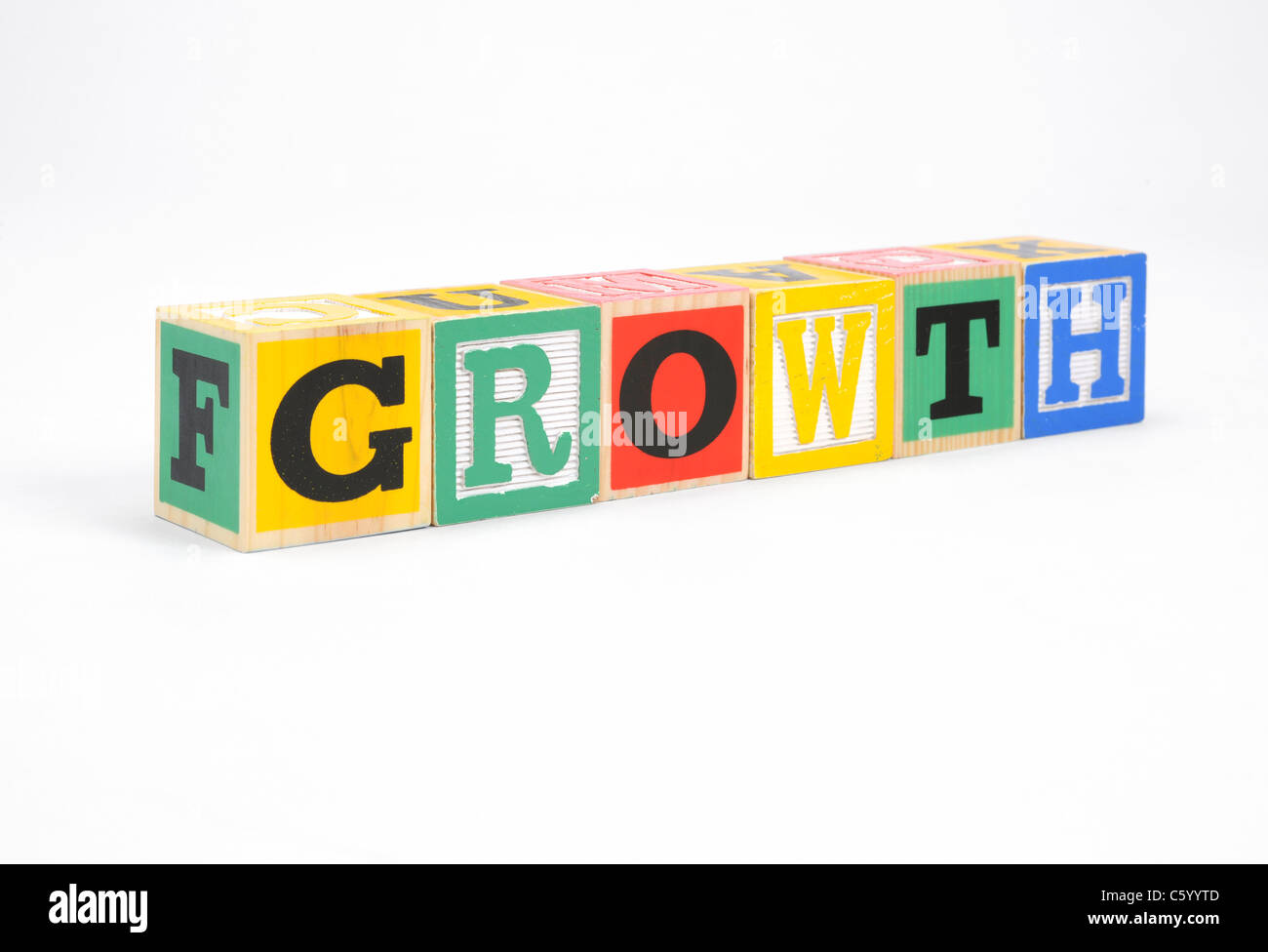 the word 'growth' spelled out with children's letter blocks Stock Photo ...