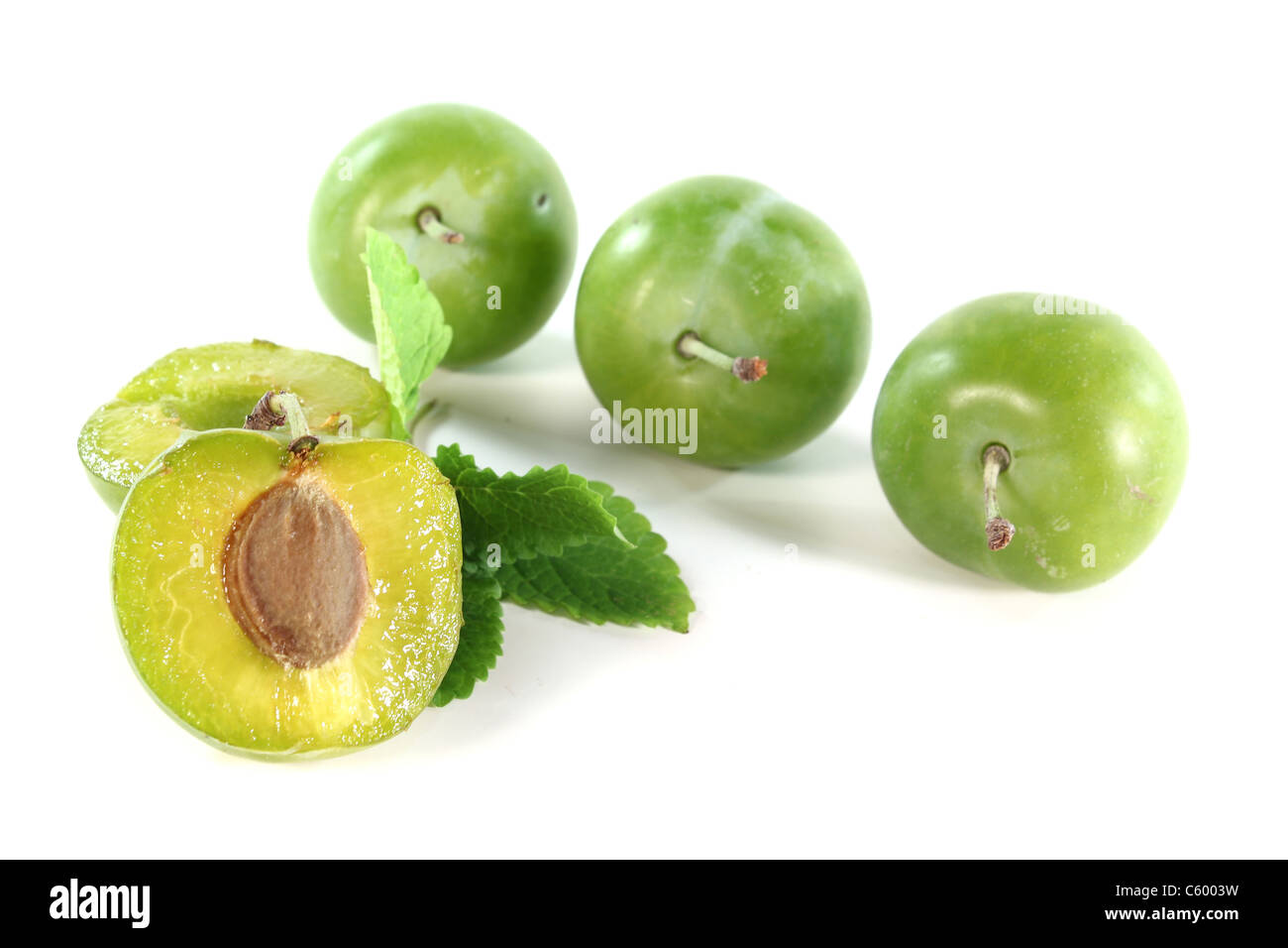fresh green Mirabelle plums on a white background Stock Photo - Alamy
