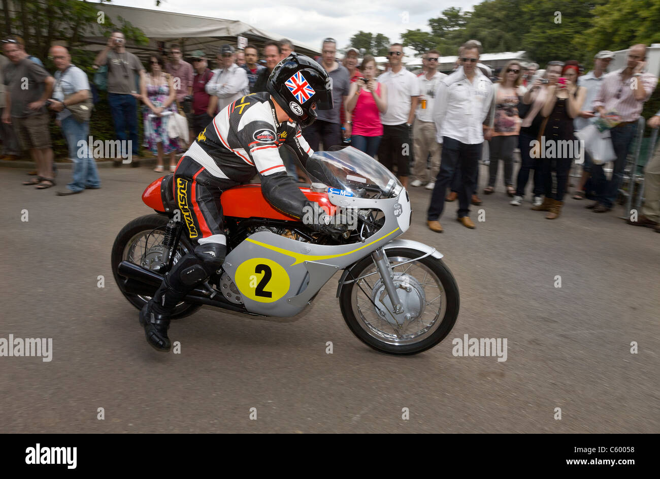 1966 type Honda RC181 leaves the paddock at the 2011 Goodwood Festival ...