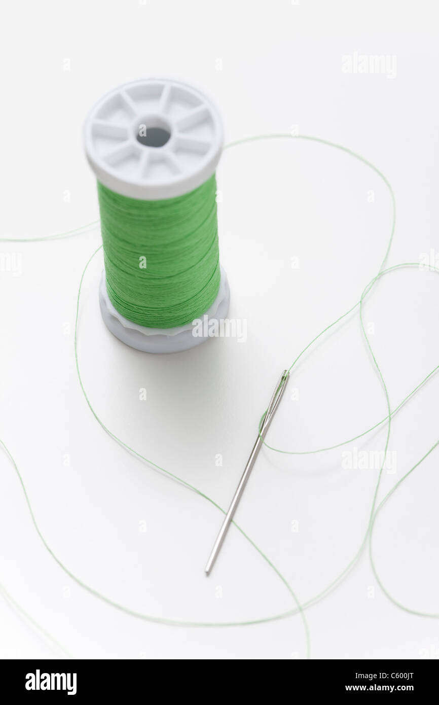 Needle and thread Stock Photo - Alamy