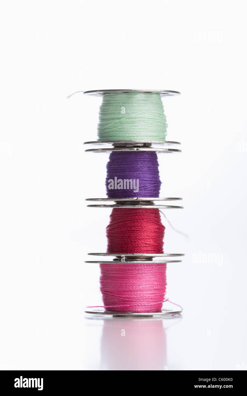 Stack of multi colored threads Stock Photo - Alamy