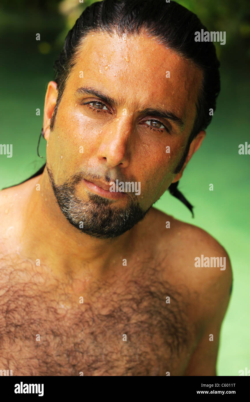 Closeup portrait of a dark tanned man on vacation in the water Stock ...