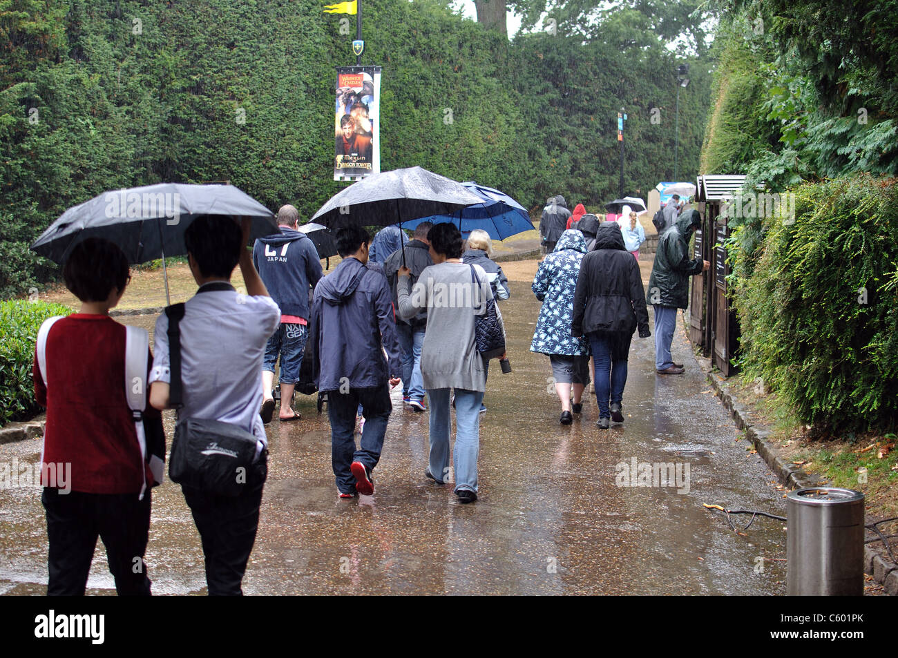 Chinese tourists with umbrellas hi-res stock photography and images - Alamy
