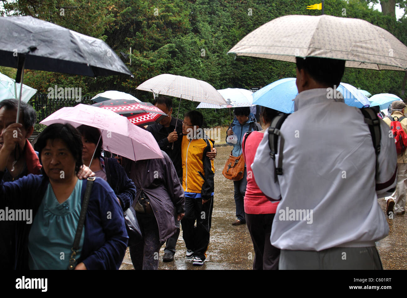 Tourists in heavy rain at Warwick Castle, UK Stock Photo - Alamy