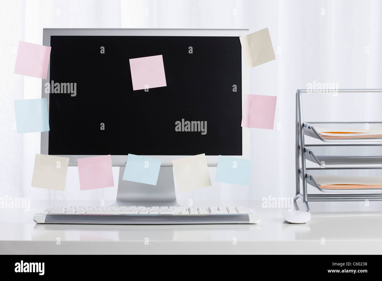 Studio shot of desktop PC with adhesive notes Stock Photo - Alamy