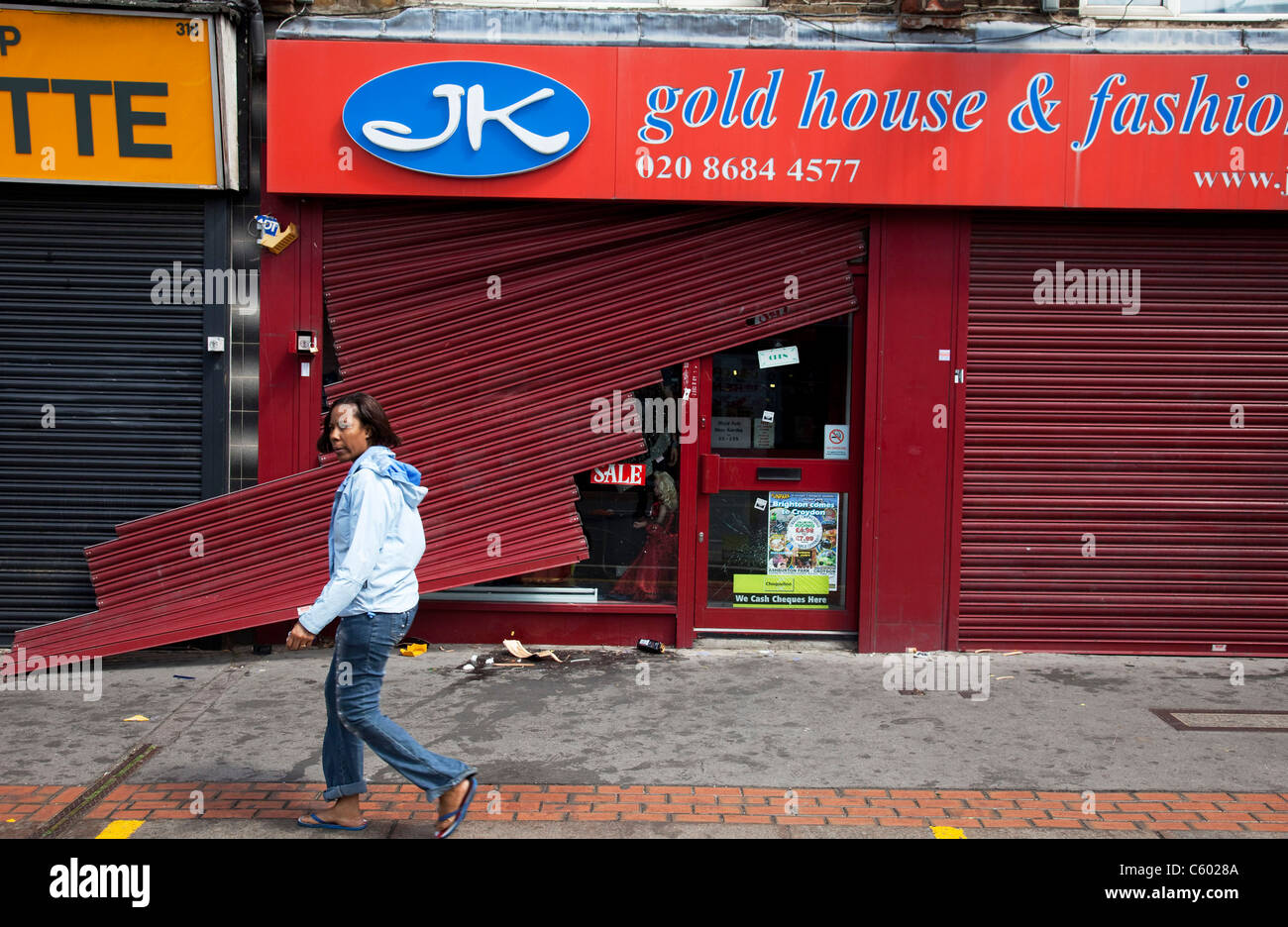Looted and smashed up shop fronts along London Road in Croydon. The day ...