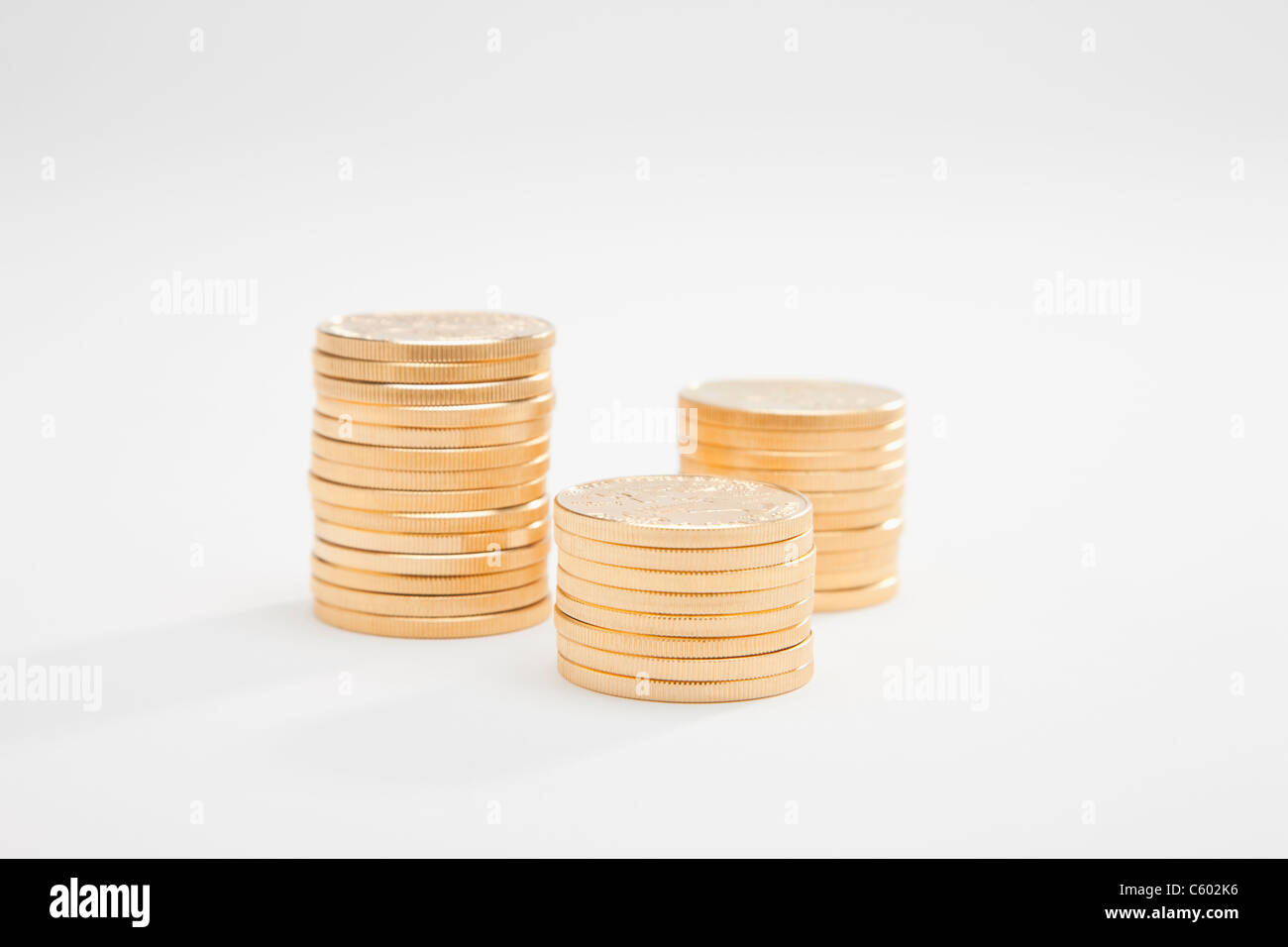 Gold coins in stack, studio shot Stock Photo - Alamy
