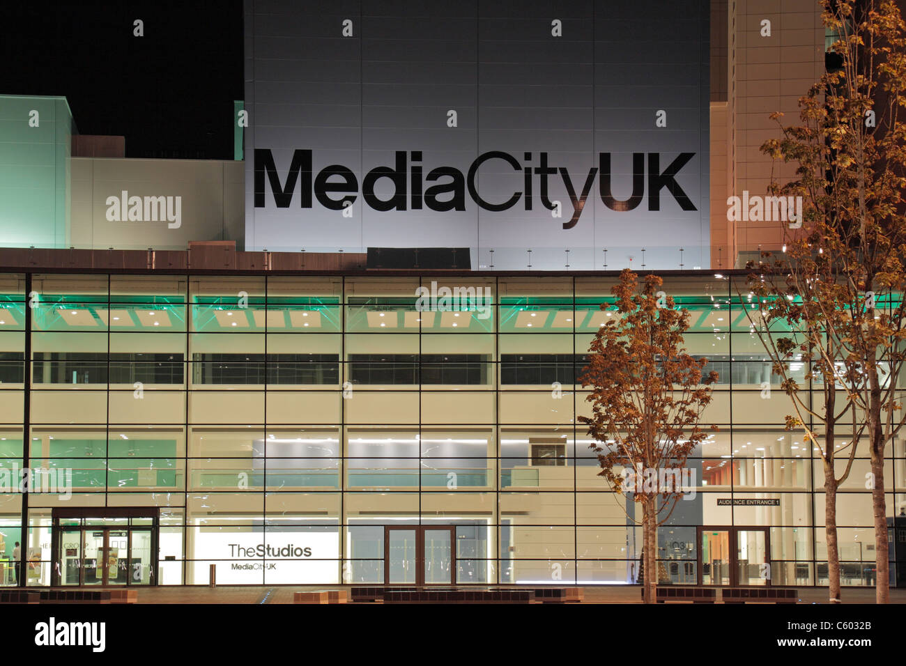 Night shot of the "MediaCityUK" sign above the entrance to BBC ...