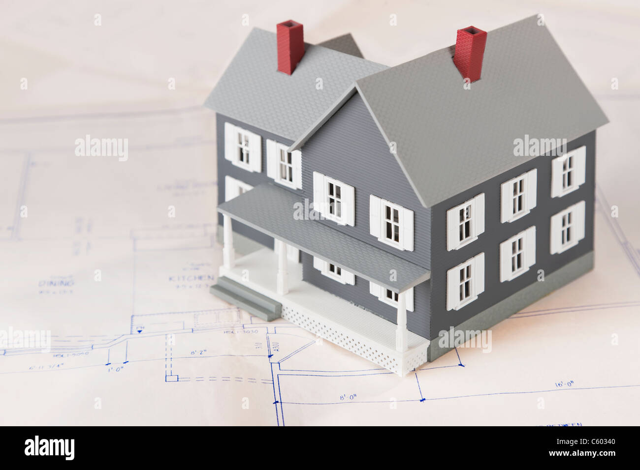 Model house on blueprint Stock Photo - Alamy
