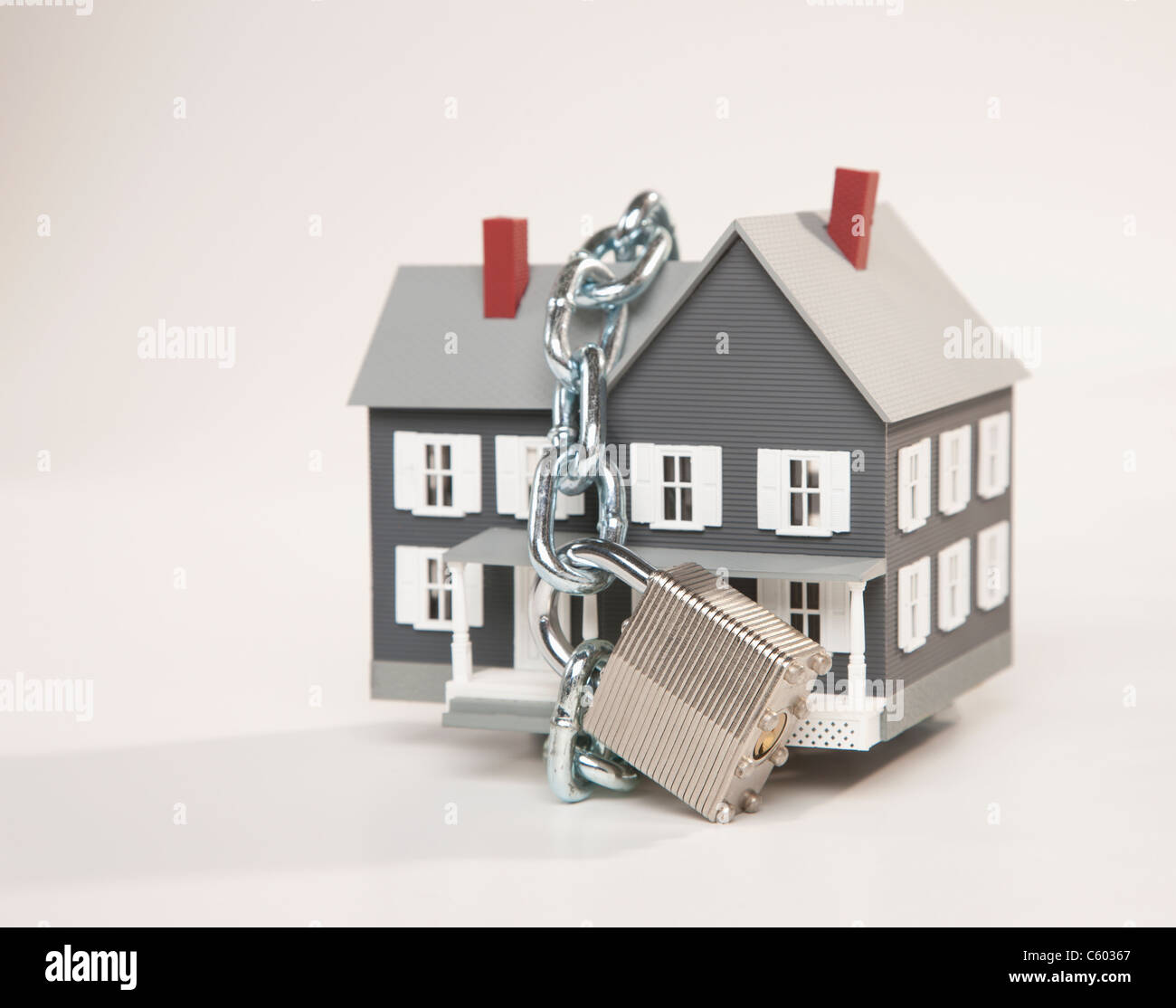 Model house in chains Stock Photo - Alamy