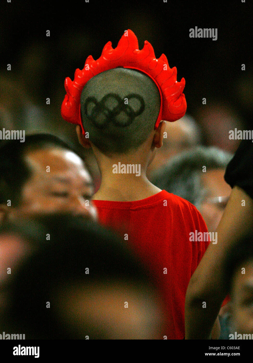 YOUNG CHINESE FAN WITH OLYMPIC BIRDS NEST STADIUM OLYMPIC STADIUM ...