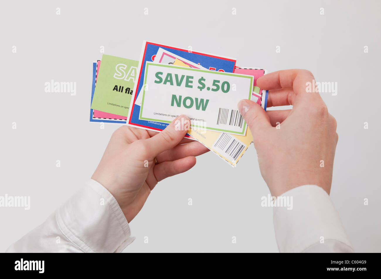 Hands holding coupons Stock Photo - Alamy