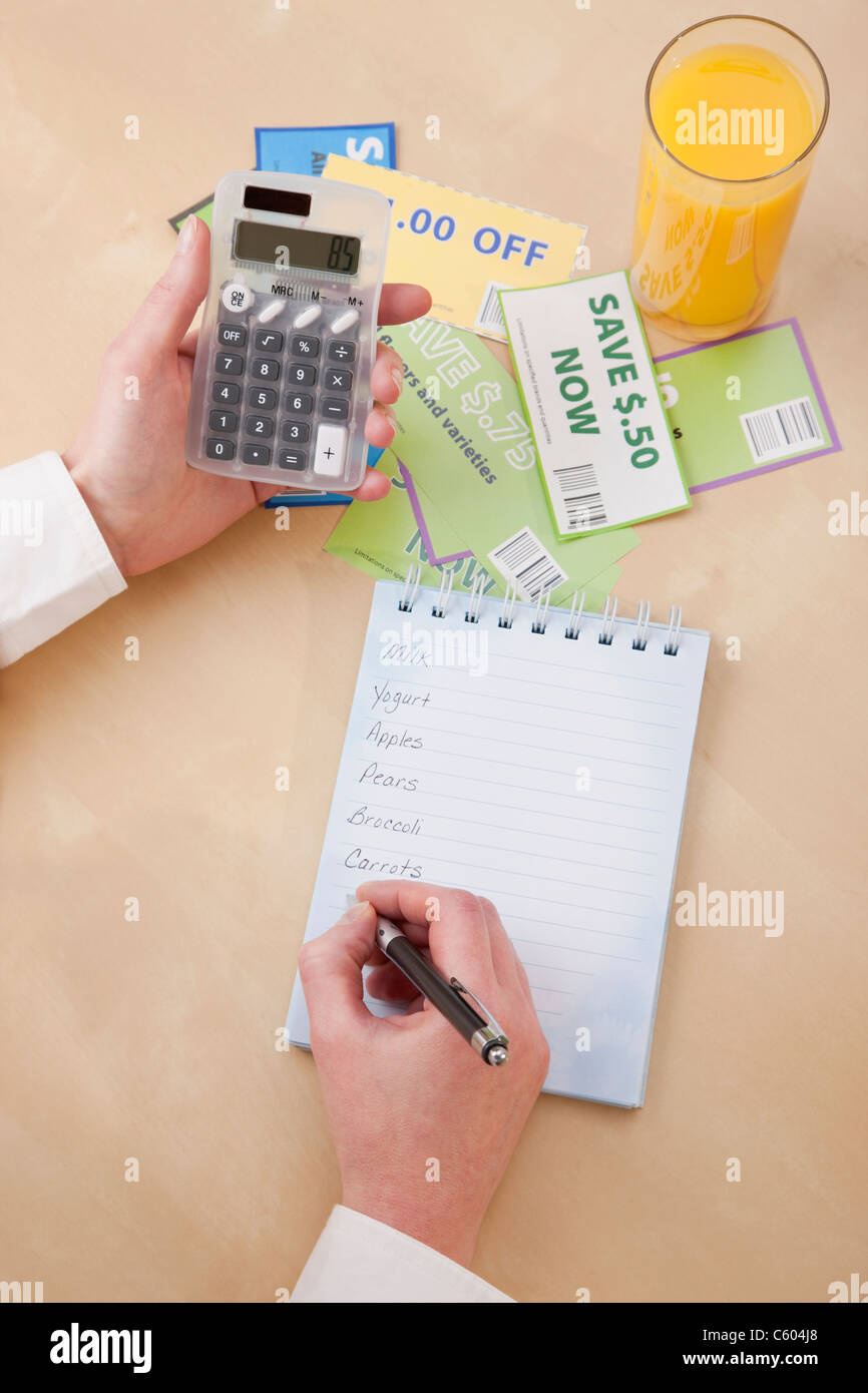 Woman doing shopping list Stock Photo - Alamy