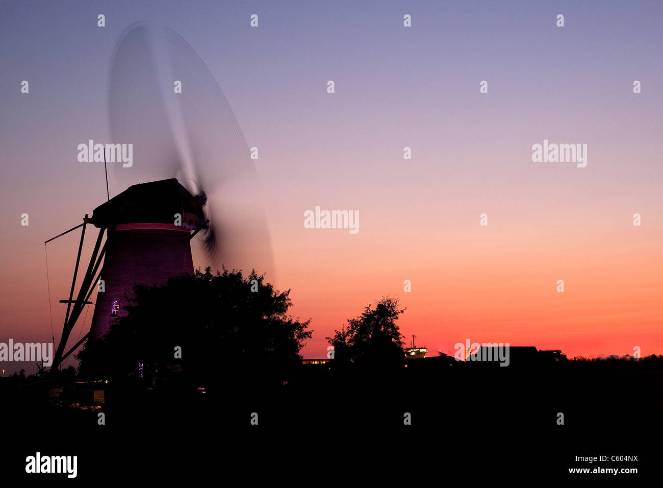 A Dutch wind mill at dawn / sunset Stock Photo - Alamy
