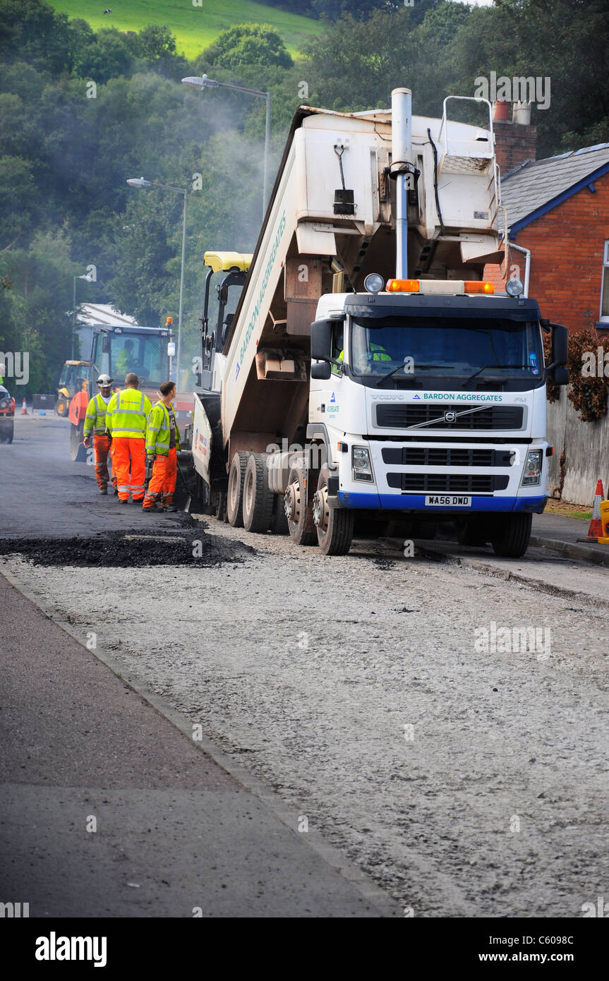 Highways maintenance workers resurfacing a local road Stock Photo - Alamy