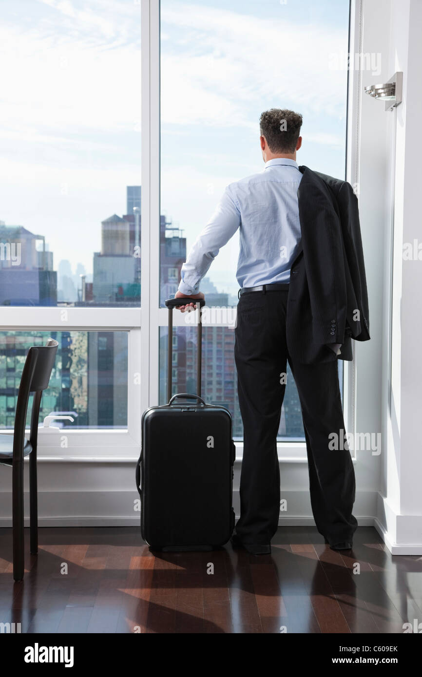 Man looking window office exterior hi-res stock photography and images ...