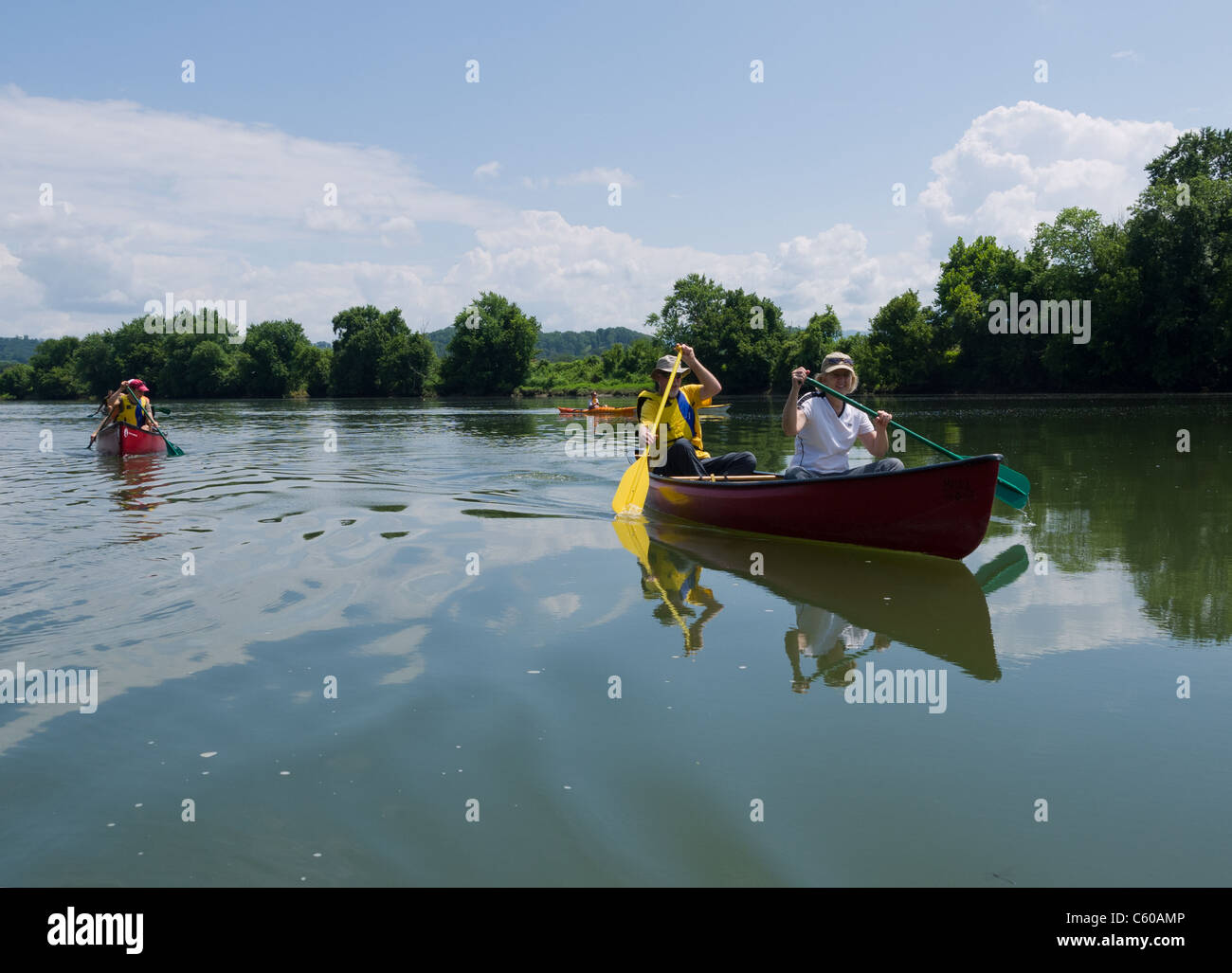 Group of people enjoy a canoe ride on the river Stock Photo - Alamy