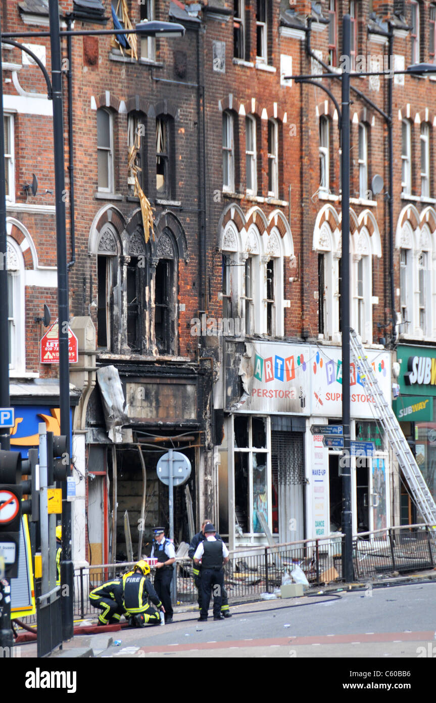 London Riots Clapham Junction burnt out shop rioting looting fire clean ...