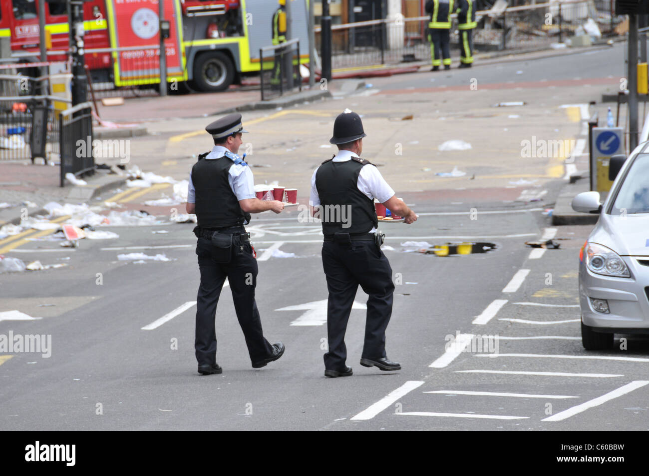 London Riots Clapham Junction burnt out shop rioting looting fire clean ...