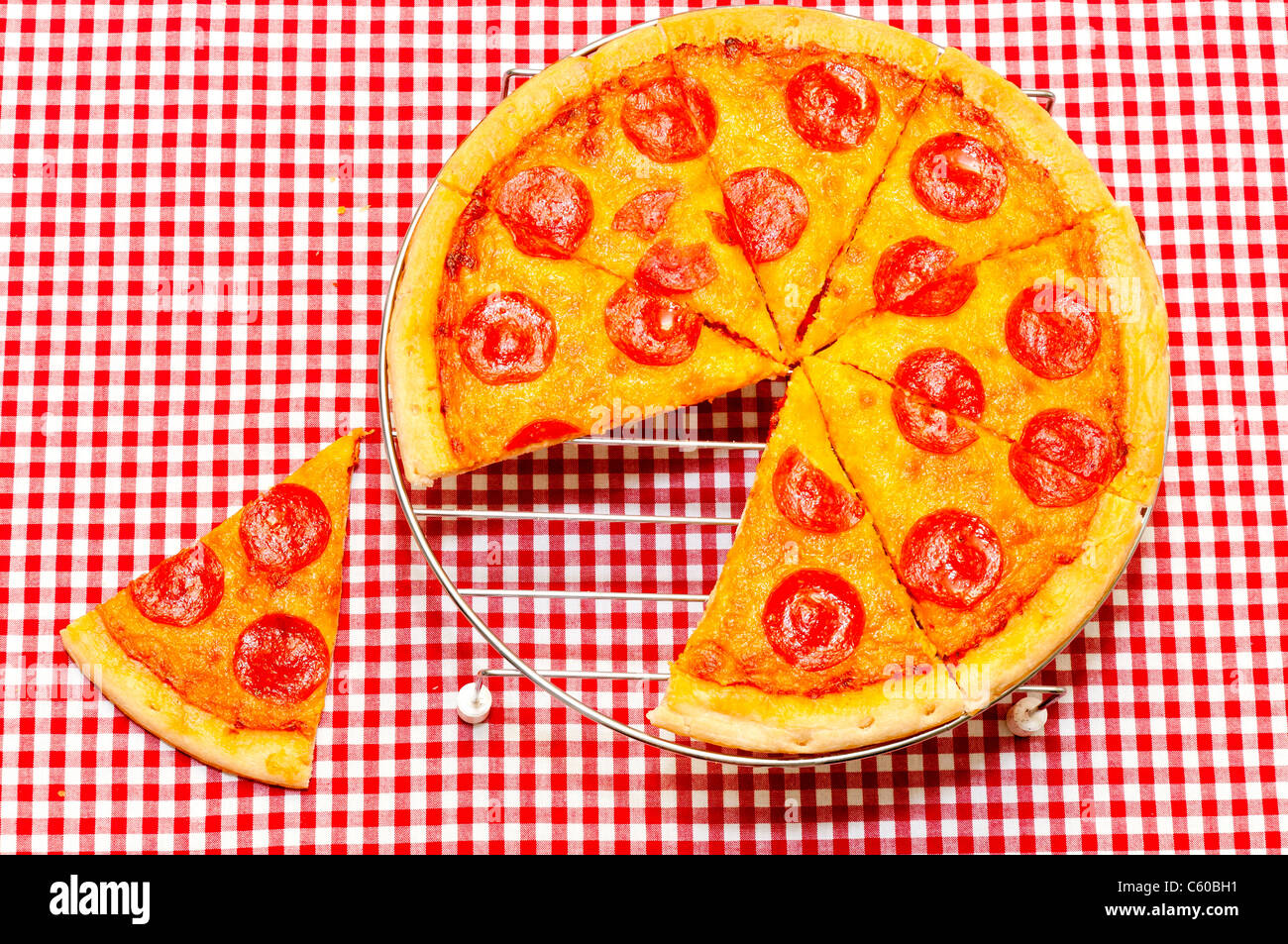 Whole Pepperoni Pizza with Slice Removed Stock Photo - Alamy