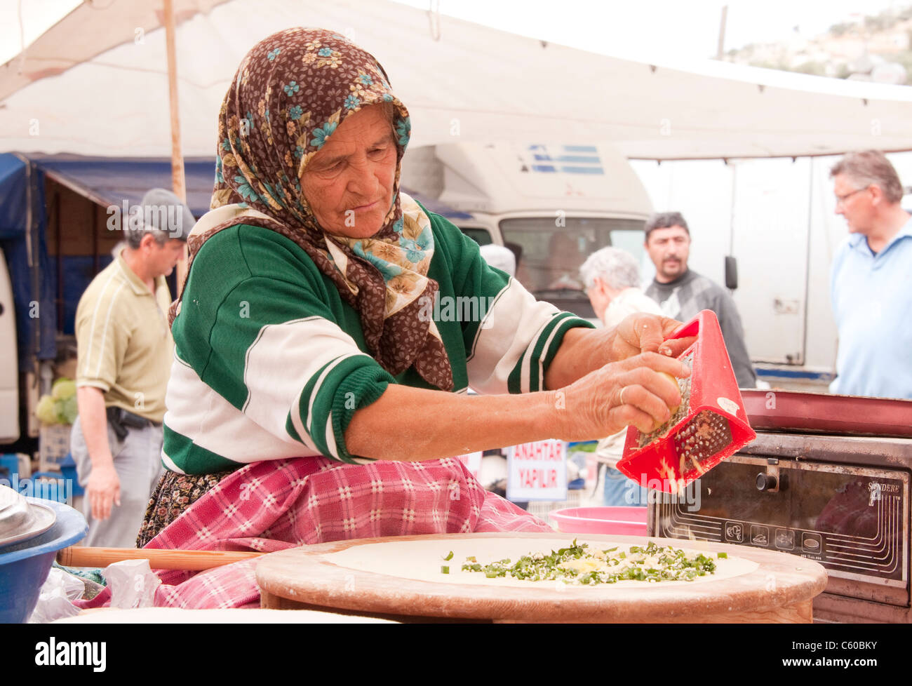 Elderly woman making Gözleme, a traditional Turkish food, Kalkan ...