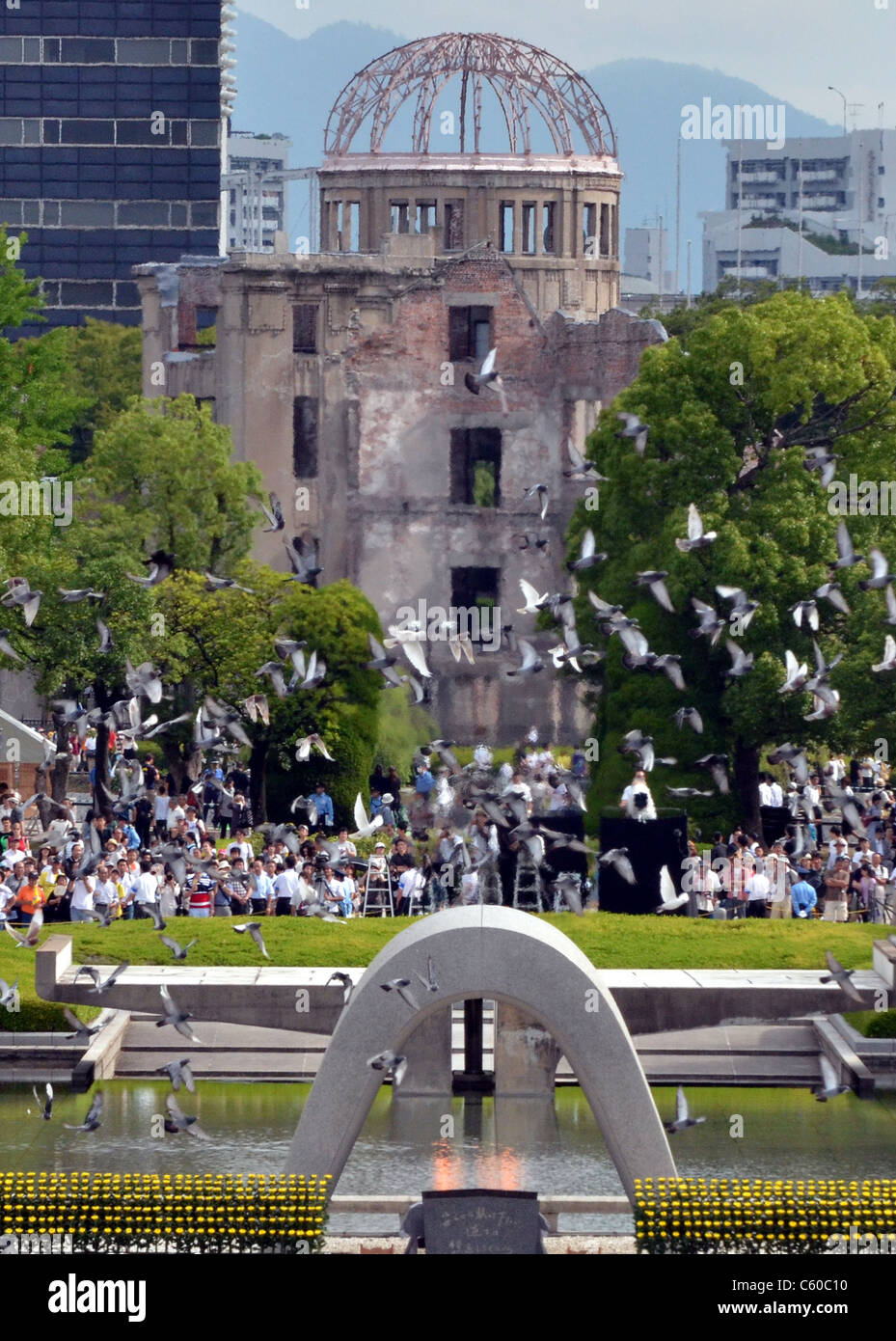 gainst the backdrop of the A-bomb dome, doves are released to highlight ...