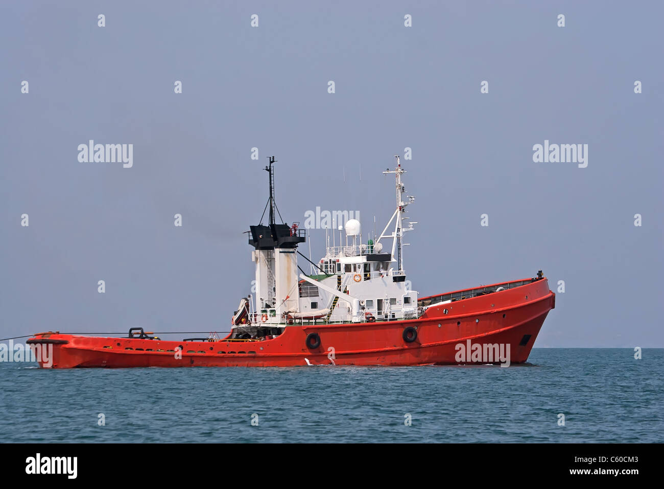 Ocean tugboat sailing in the sea Stock Photo - Alamy