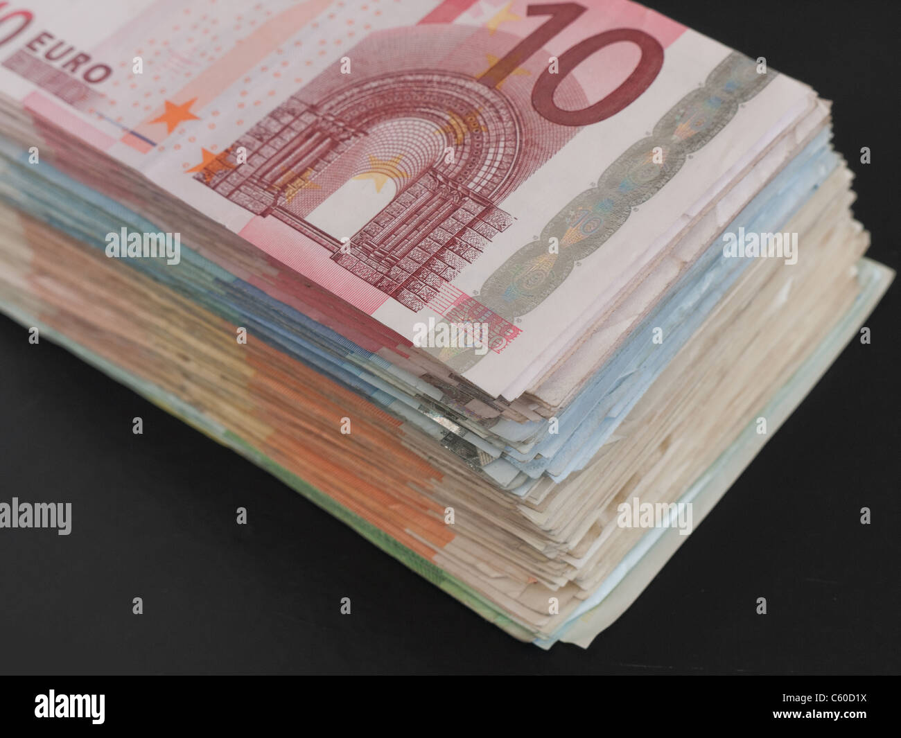 A stack of Euro banknotes on black background Stock Photo - Alamy