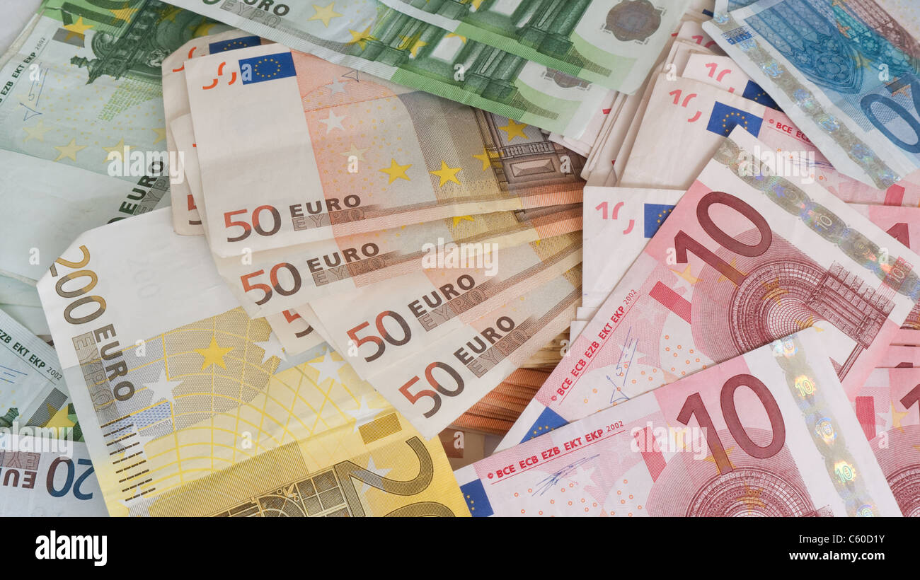 Different Euro banknotes spread over the photo Stock Photo - Alamy
