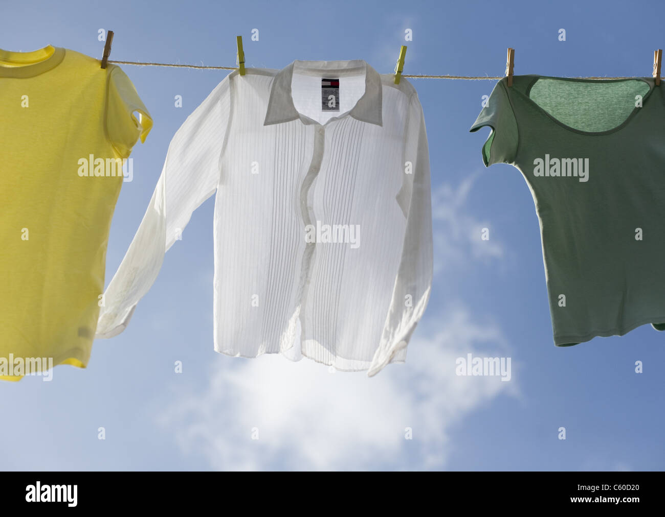 Shirts hanging on clothesline Stock Photo - Alamy