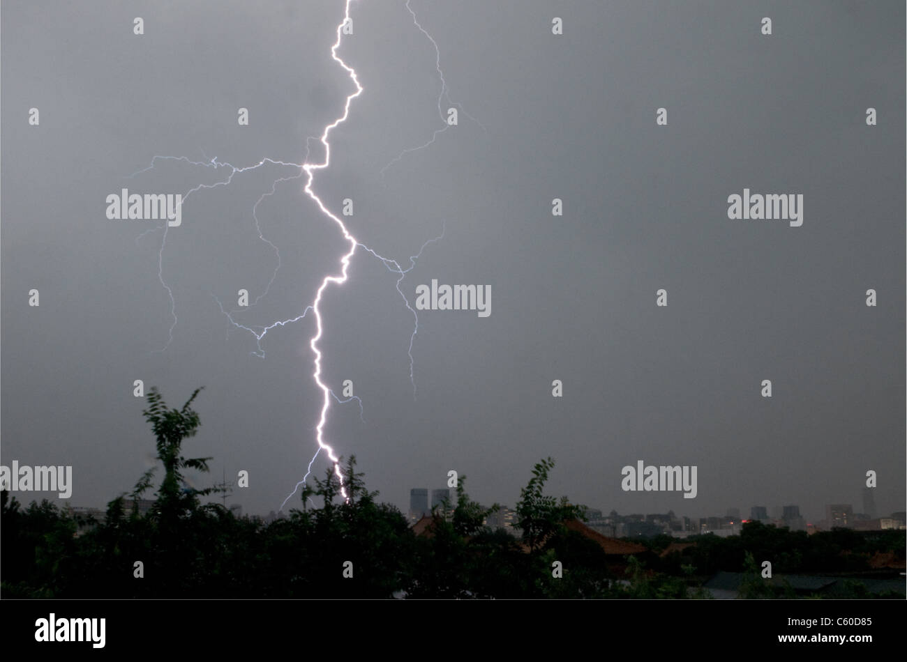 Lightning bolts strike during a storm over the capital city of Beijing ...
