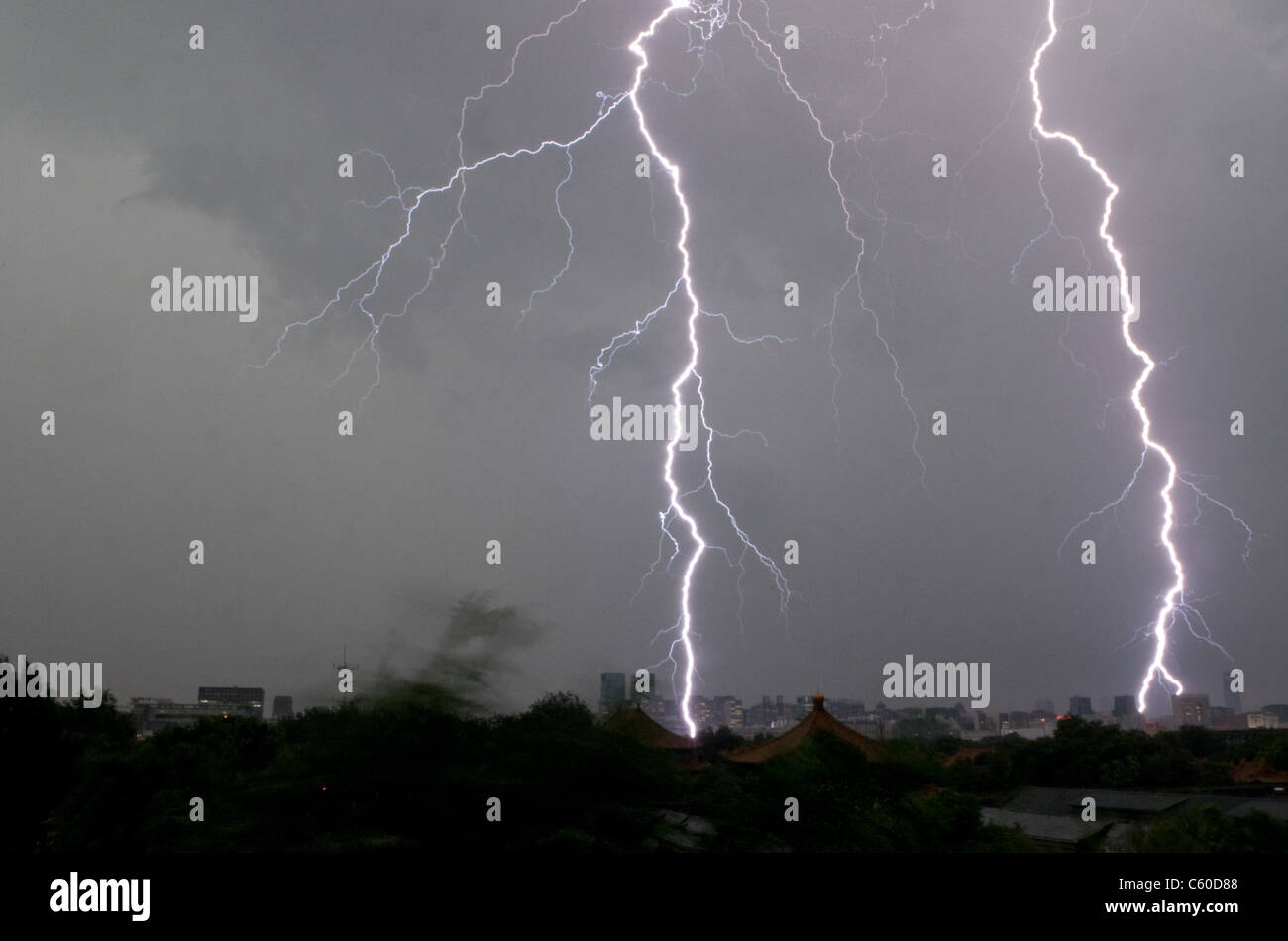 Lightning bolts strike during a storm over the capital city of Beijing ...