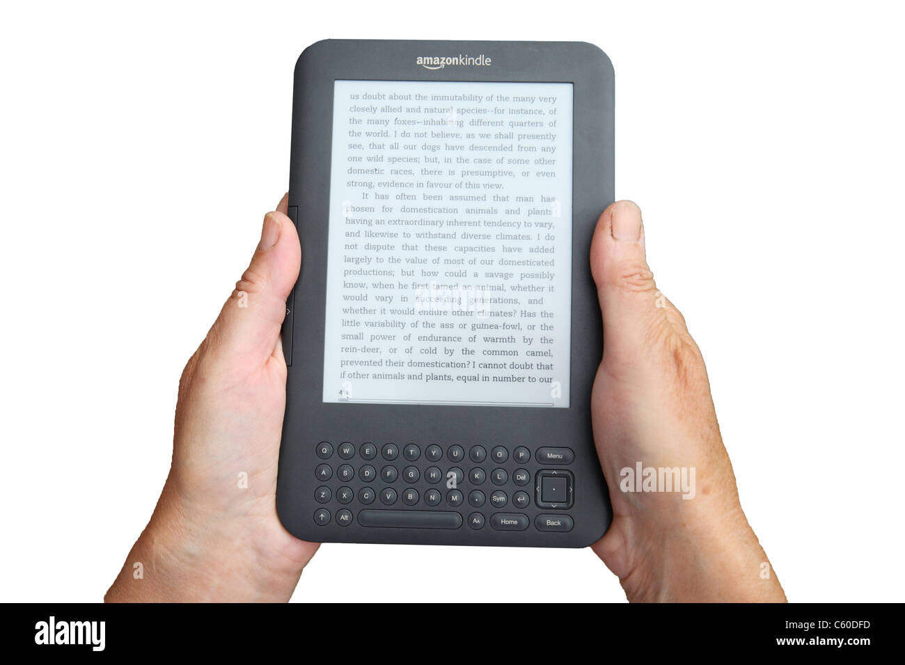 An Amazon Kindle E-book reader held within a woman's hands isolated on ...