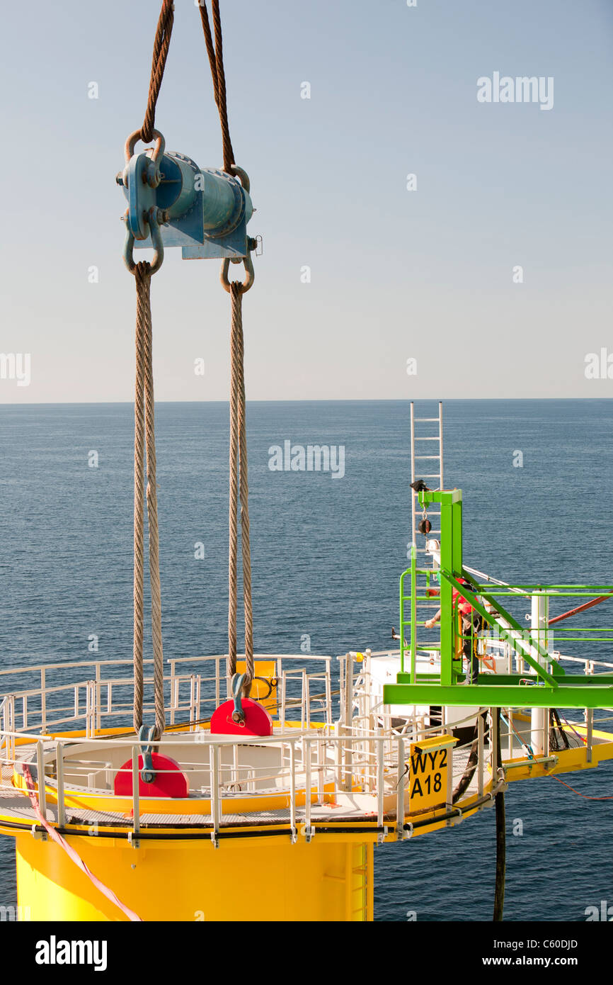 A transition piece is fitted to a monopile on the Walney offshore wind ...