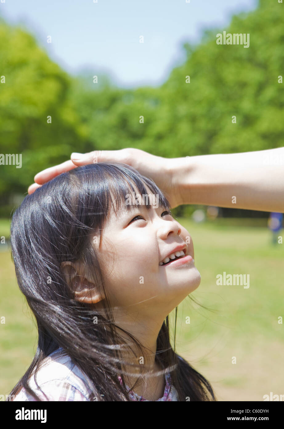 Child pat on head hi-res stock photography and images - Alamy