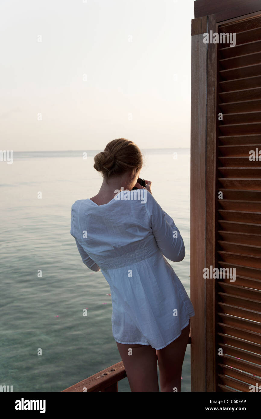 Woman posing balcony ocean hi-res stock photography and images - Alamy