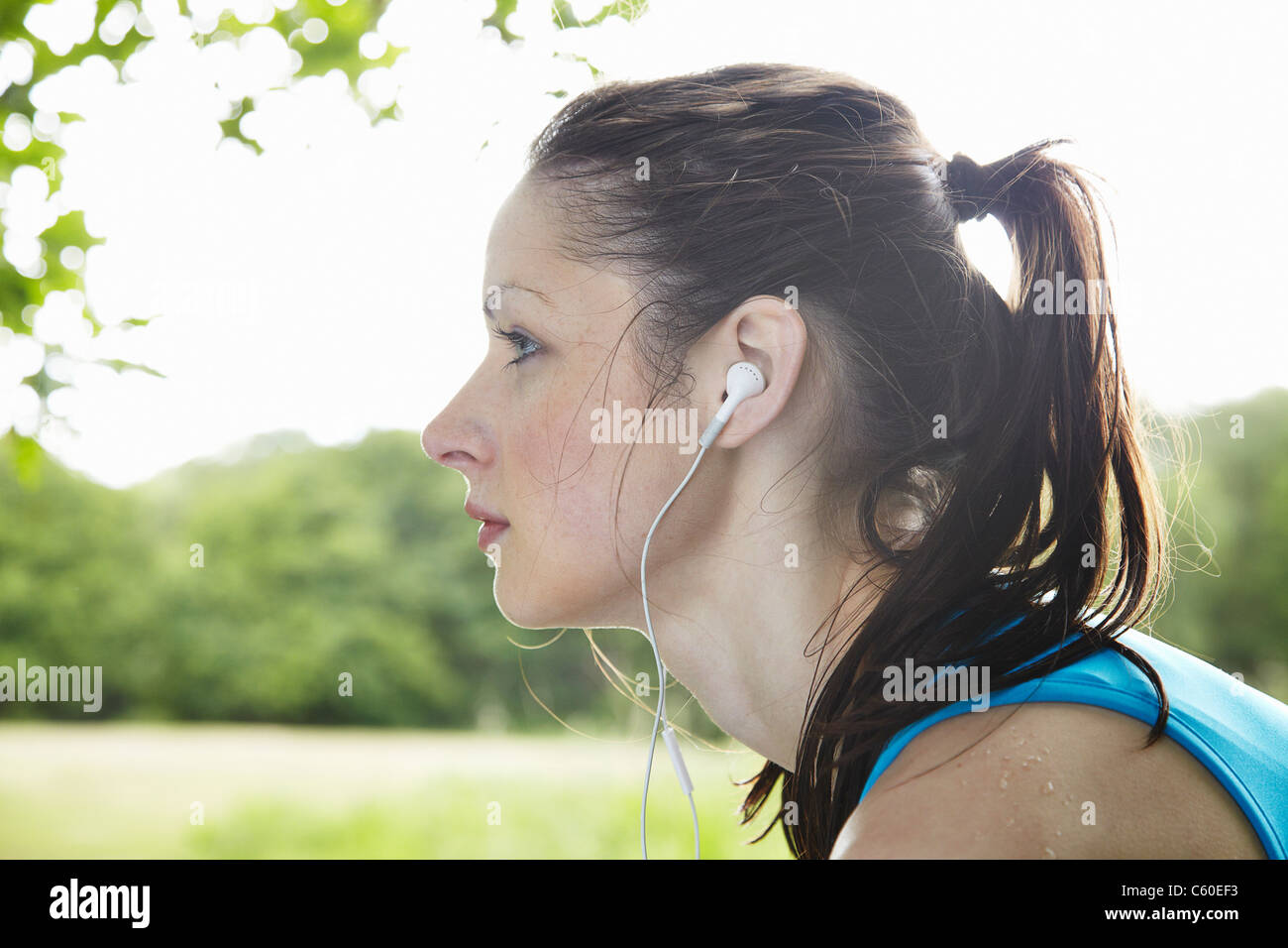 Runner wearing headphones Stock Photo - Alamy