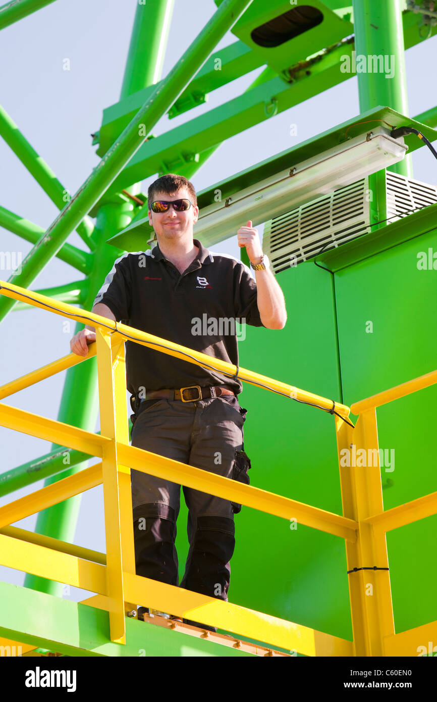 A crane operator on a jack up barge constructing the Walney offshore ...